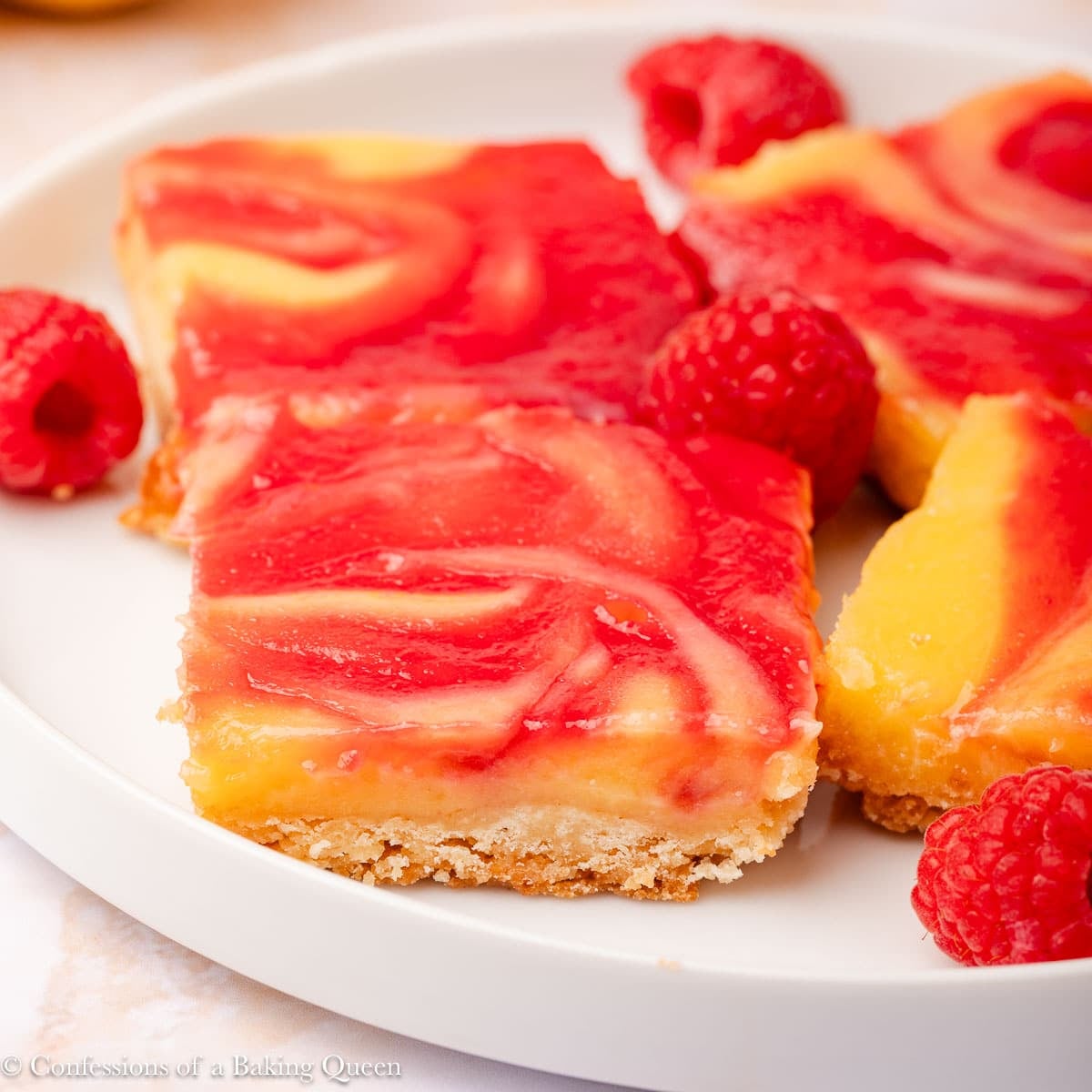 Tart and Sweet Raspberry Lemon Bars - Confessions of a Baking Queen